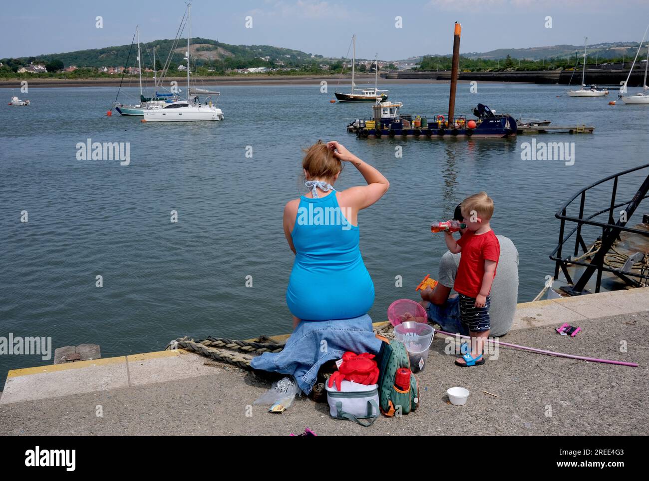 Family crab fishing at Conwy in North Wales Stock Photo - Alamy