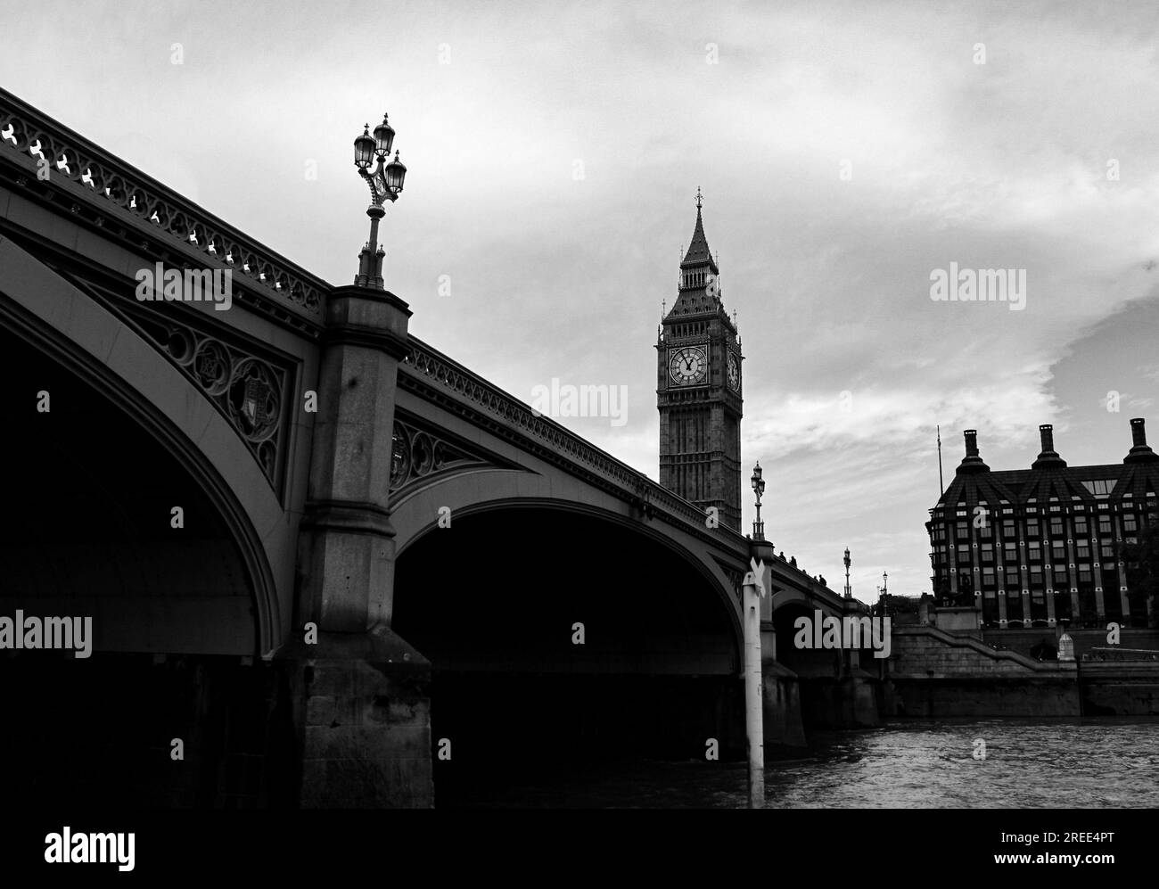 Low angle view of a bridge with a clock tower in the background Stock ...
