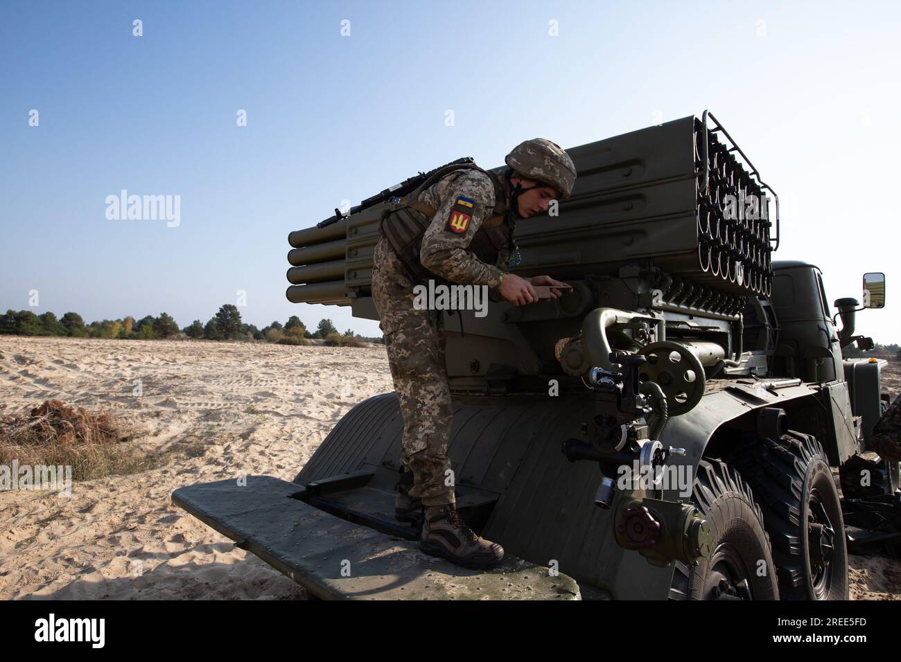 Soldiers prepare to fire a launch rocket system BM-21 Grad during ...