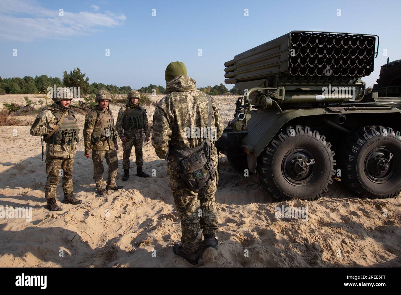 Soldiers of Ukrainian army stand near a launch rocket system BM-21 Grad ...