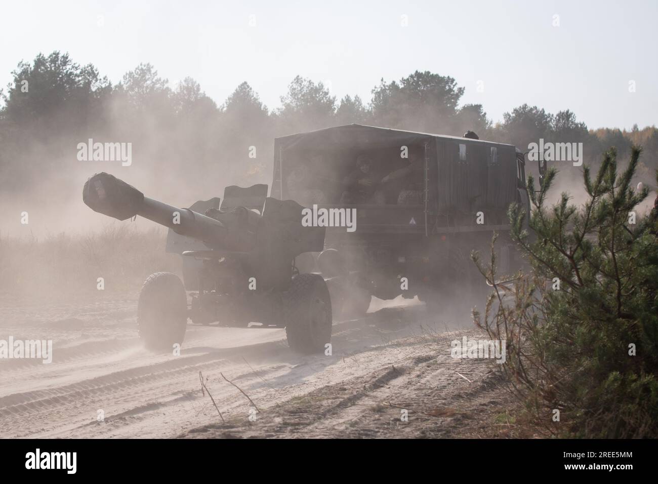 Army truck carrying the 152 mm towed gun-howitzer D-20 during exercises ...