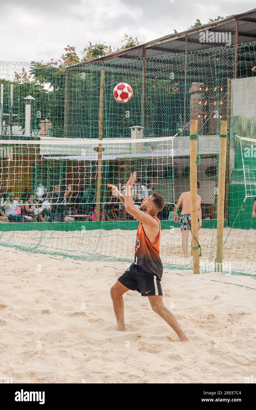 Two men playing football in the beach hi-res stock photography and ...