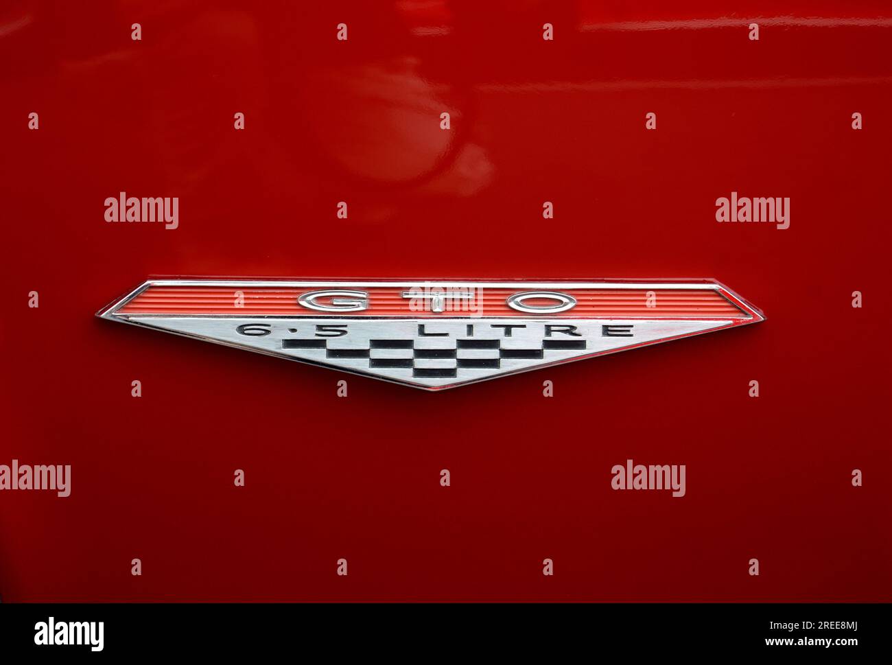 A vintage Pontiac GTO 6.5 litre emblem on a car displayed at a custom ...