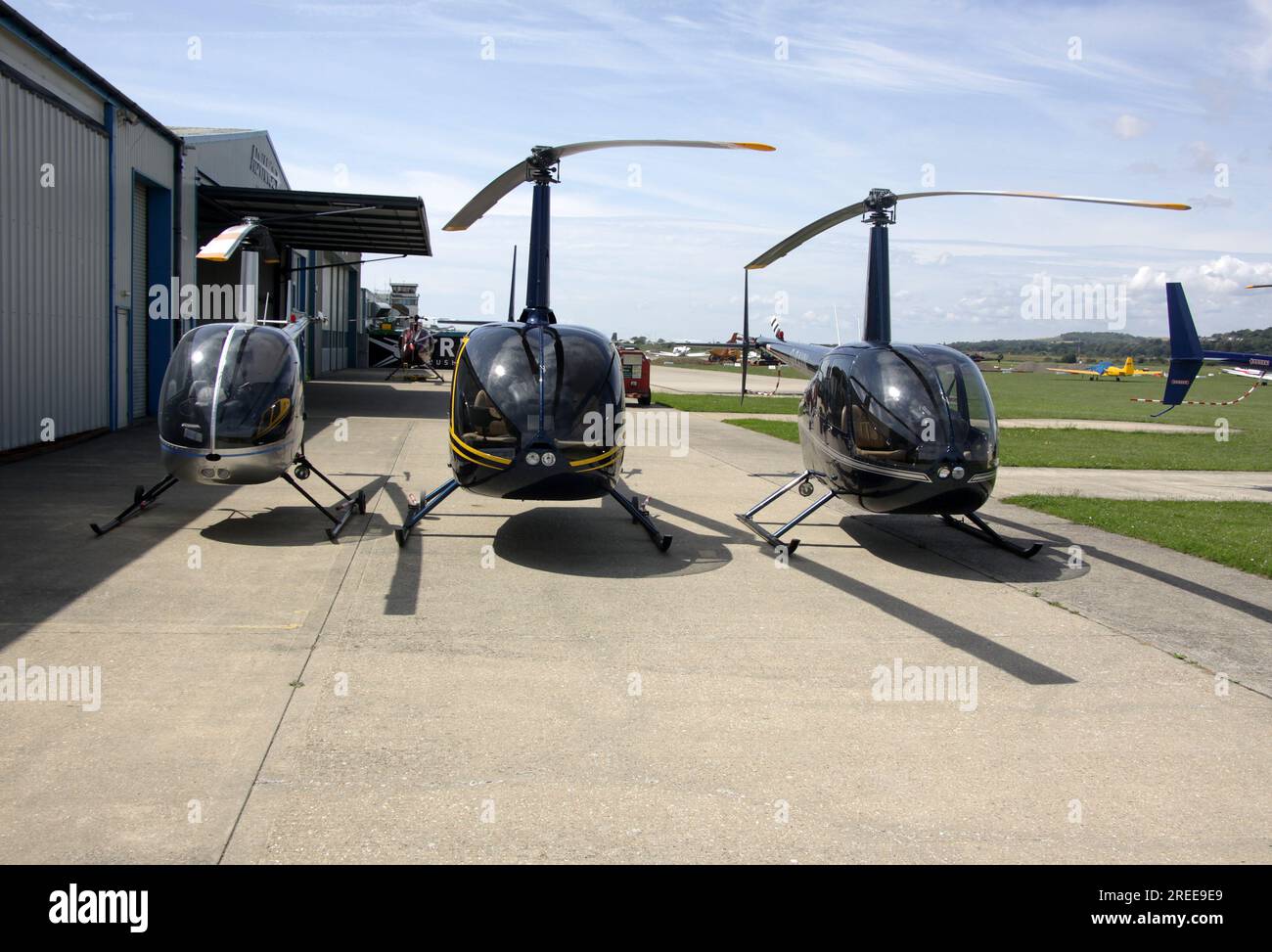 Several Robinson helicopters on the ramp at Brighton City Airport. L-R ...