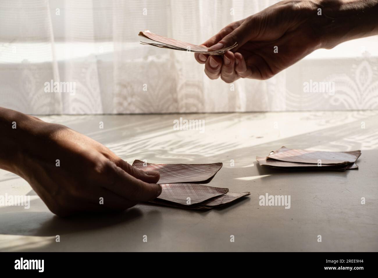 Green hand holding playing cards hi-res stock photography and images ...