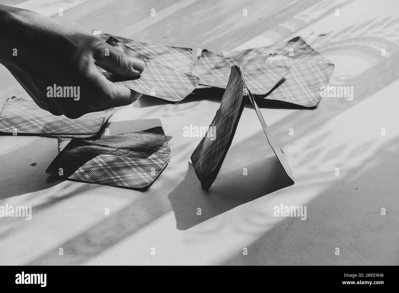 Playing cards at the table near the window at home, gambling board ...