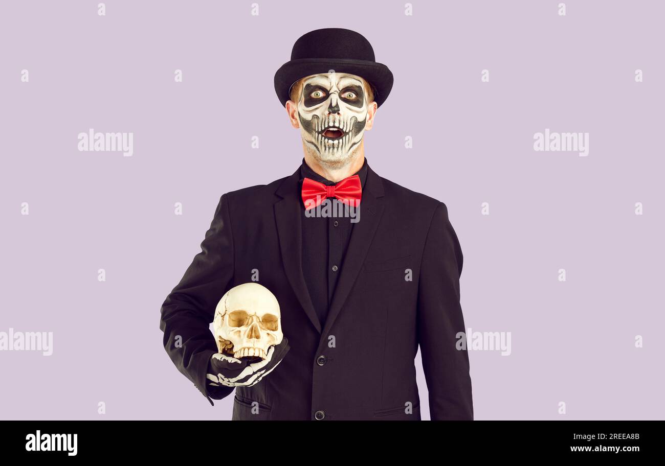Portrait of man with skeleton makeup who is looking at you with ...