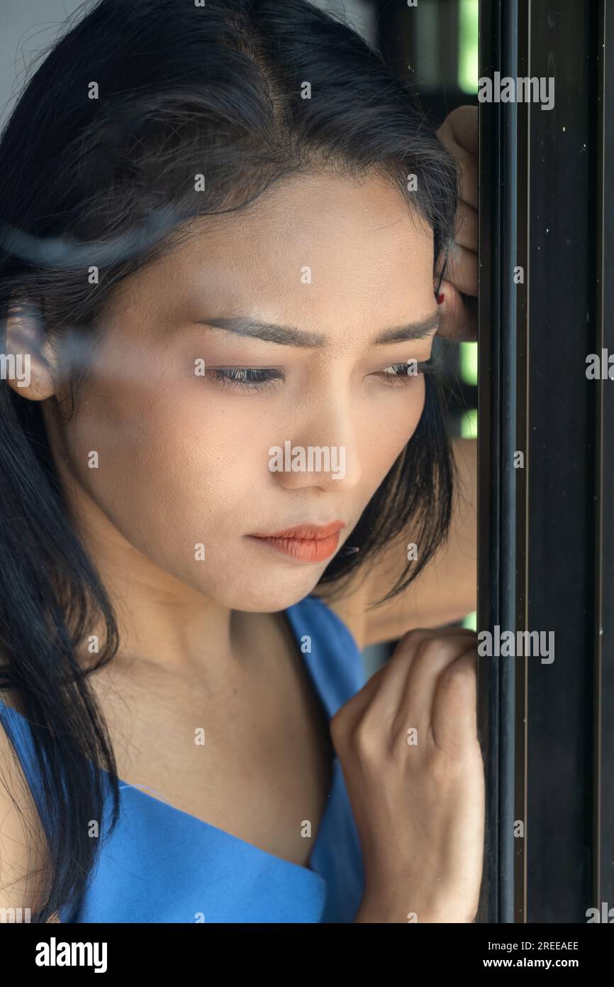 Woman behind glass door hi-res stock photography and images - Alamy