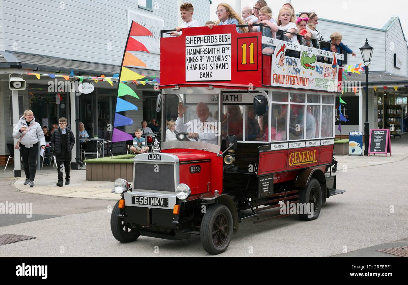 An old vintage bus taking young family members for a spin around the ...