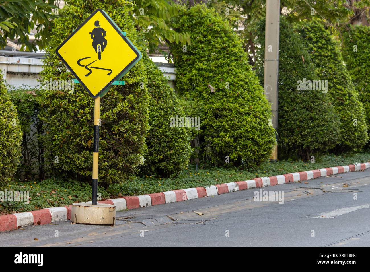 A road sign warning of a slippery road surface Stock Photo - Alamy