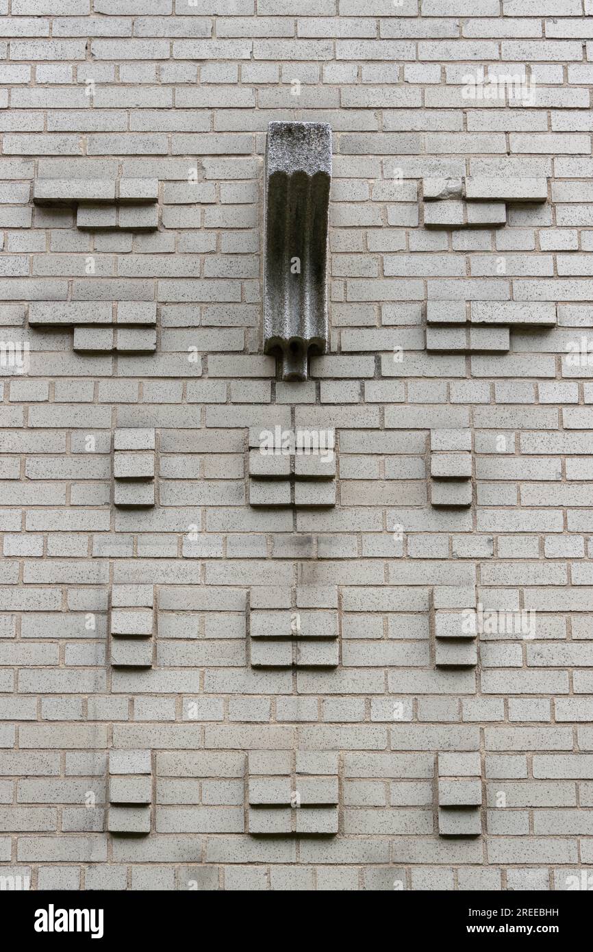 gray brick wall with art deco decorative geometric brick patterns and a ...