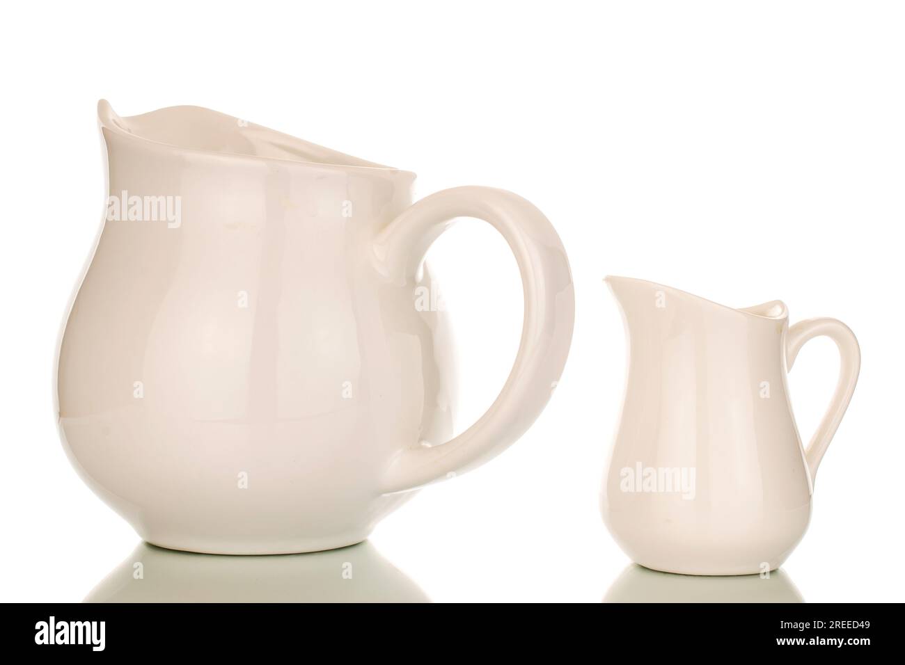 Two ceramic jugs, macro, isolated on white background Stock Photo - Alamy