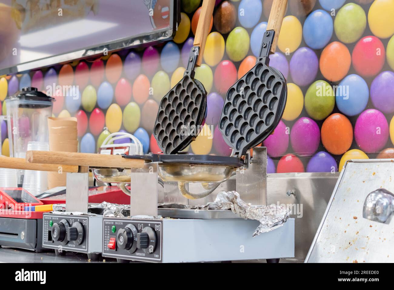 Open waffle irons at a street food stall Stock Photo - Alamy