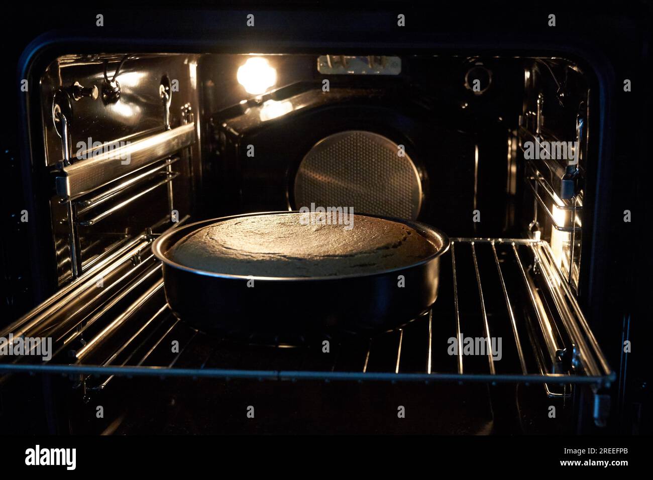 The cake is cooked in the oven Stock Photo - Alamy