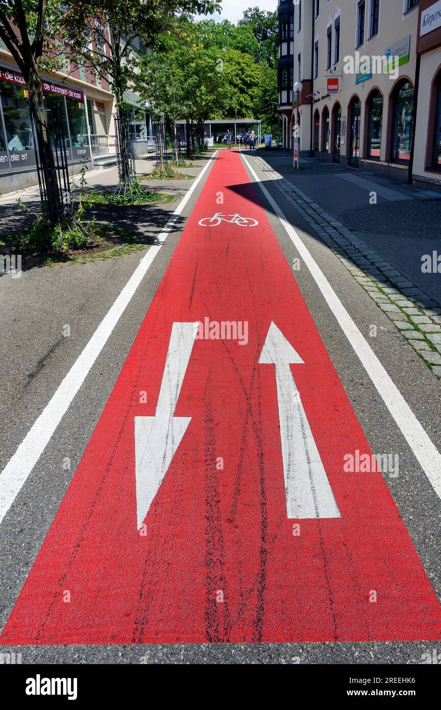 Red cycle path with white arrows, Kempten, Allgaeu, Bavaria, Germany ...