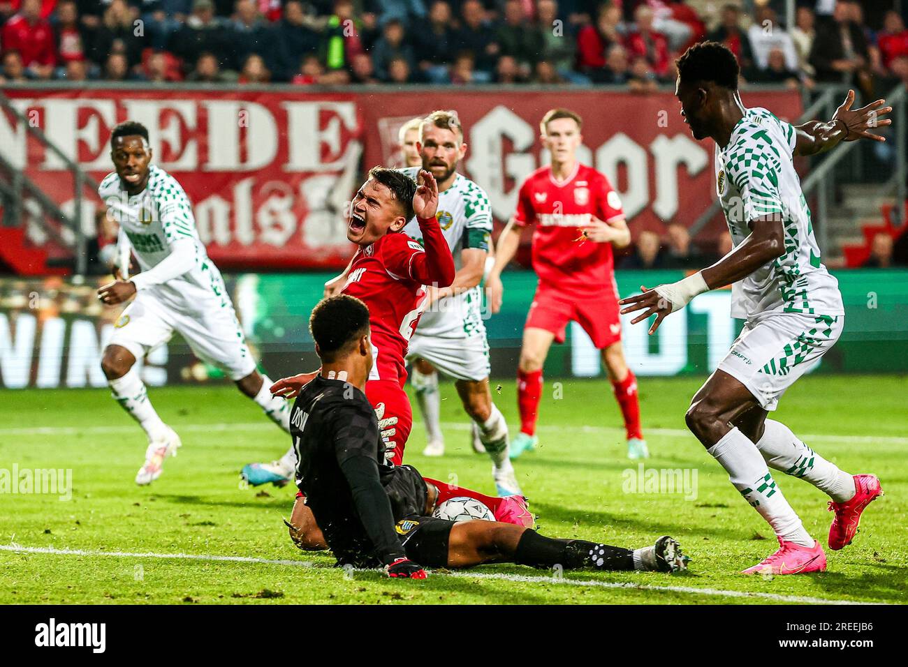 ENSCHEDE - Tackle on Manfred Ugalde of FC Twente during the match for the UEFA Conference League ...