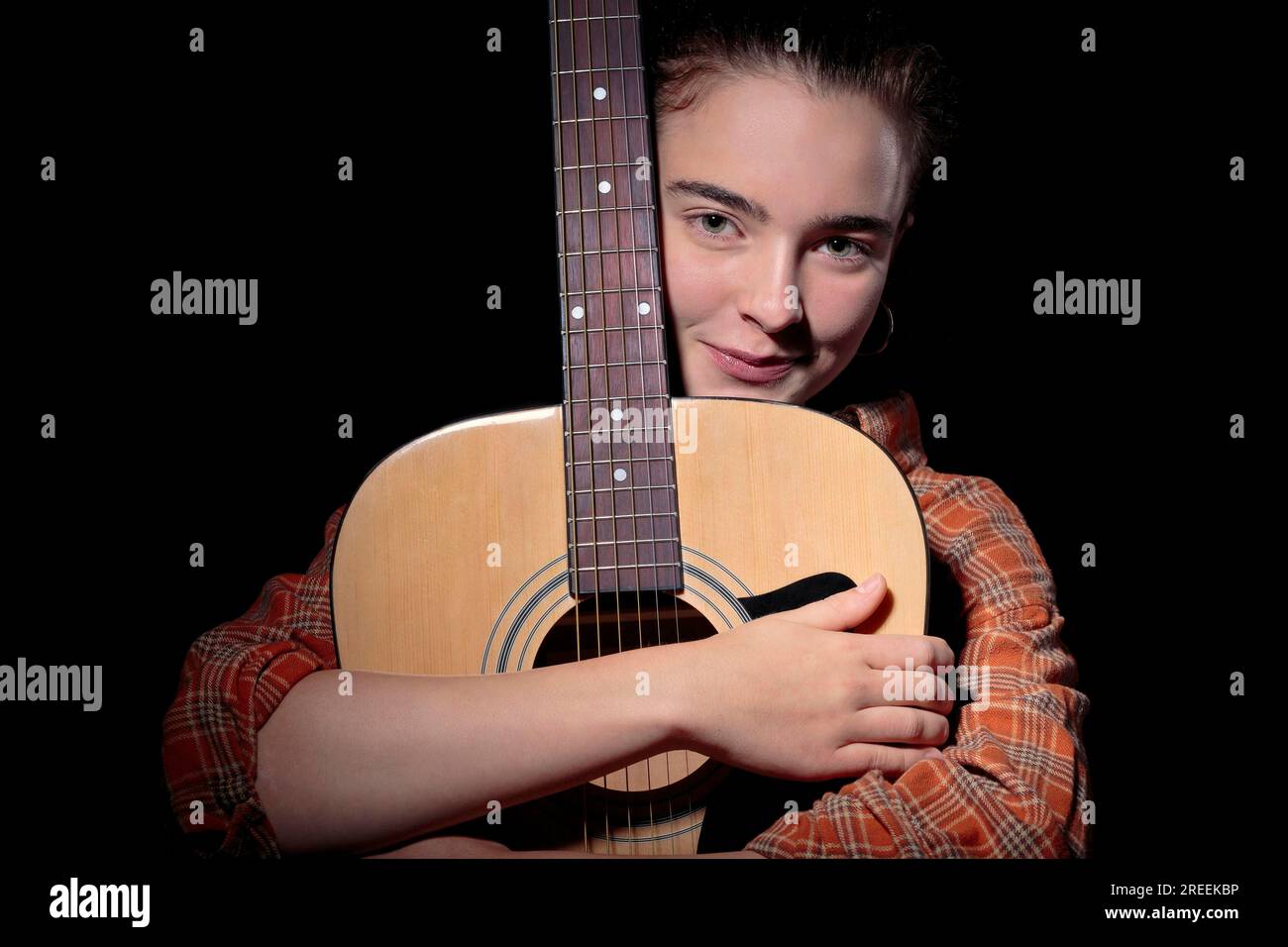 Hugging guitar hi-res stock photography and images - Alamy