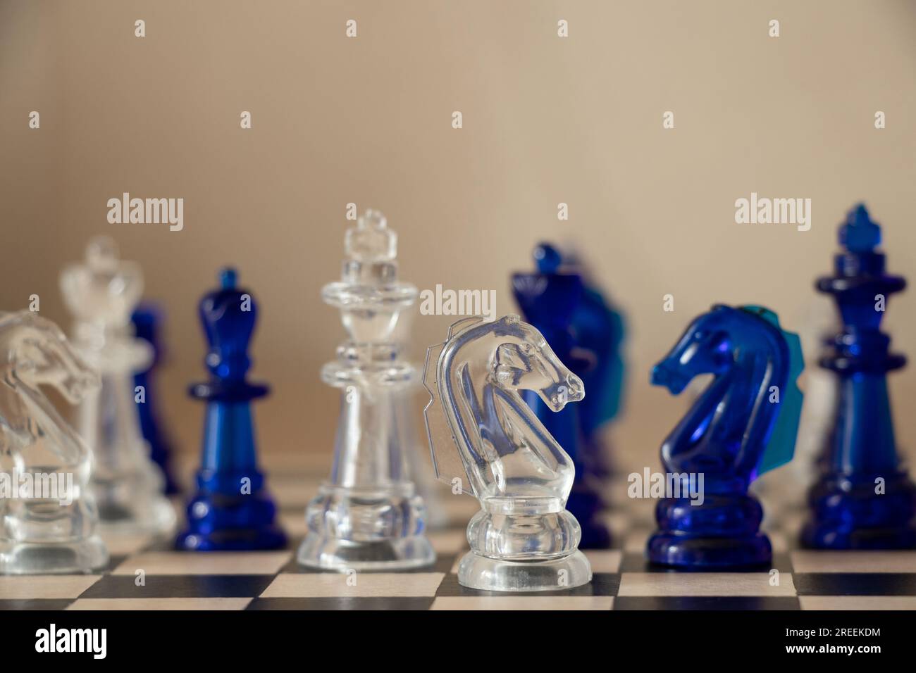 Transparent chess on a chessboard close-up, chess game and hobby Stock ...