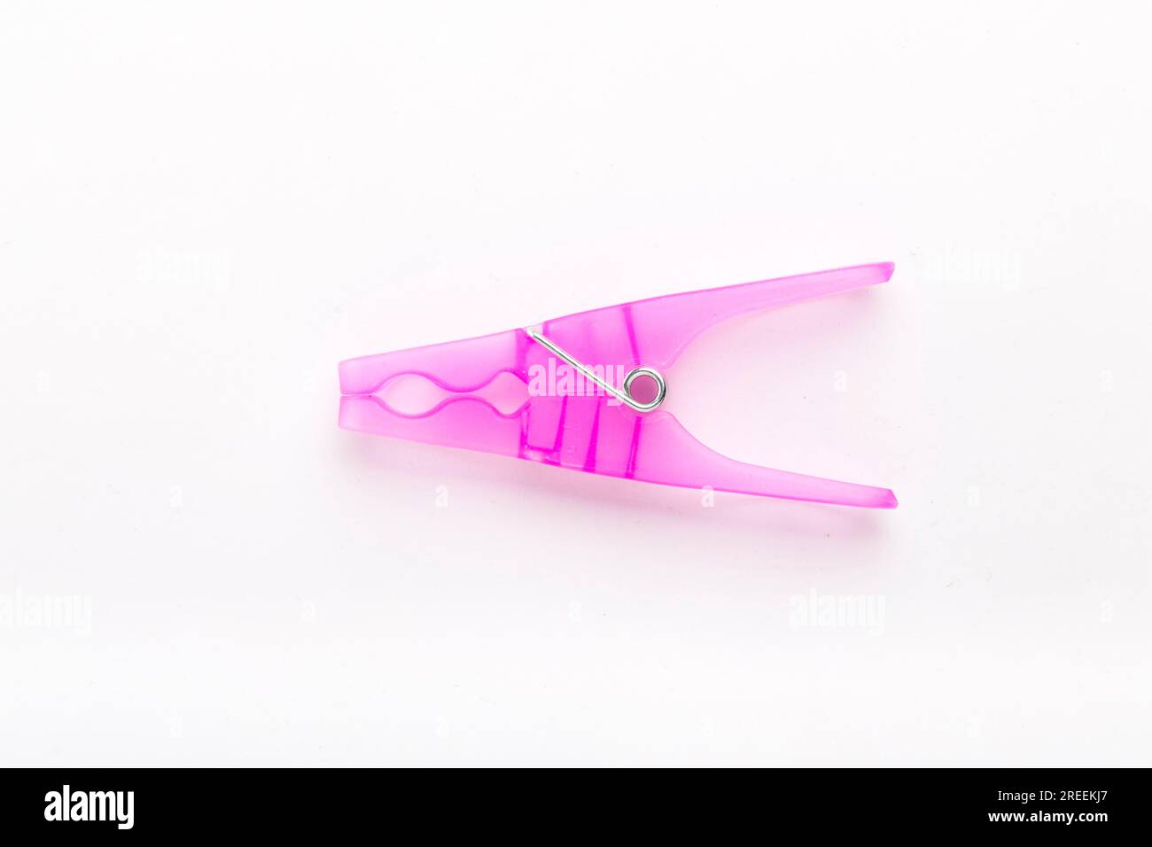 Pink plastic clothespin, isolated on white Stock Photo - Alamy