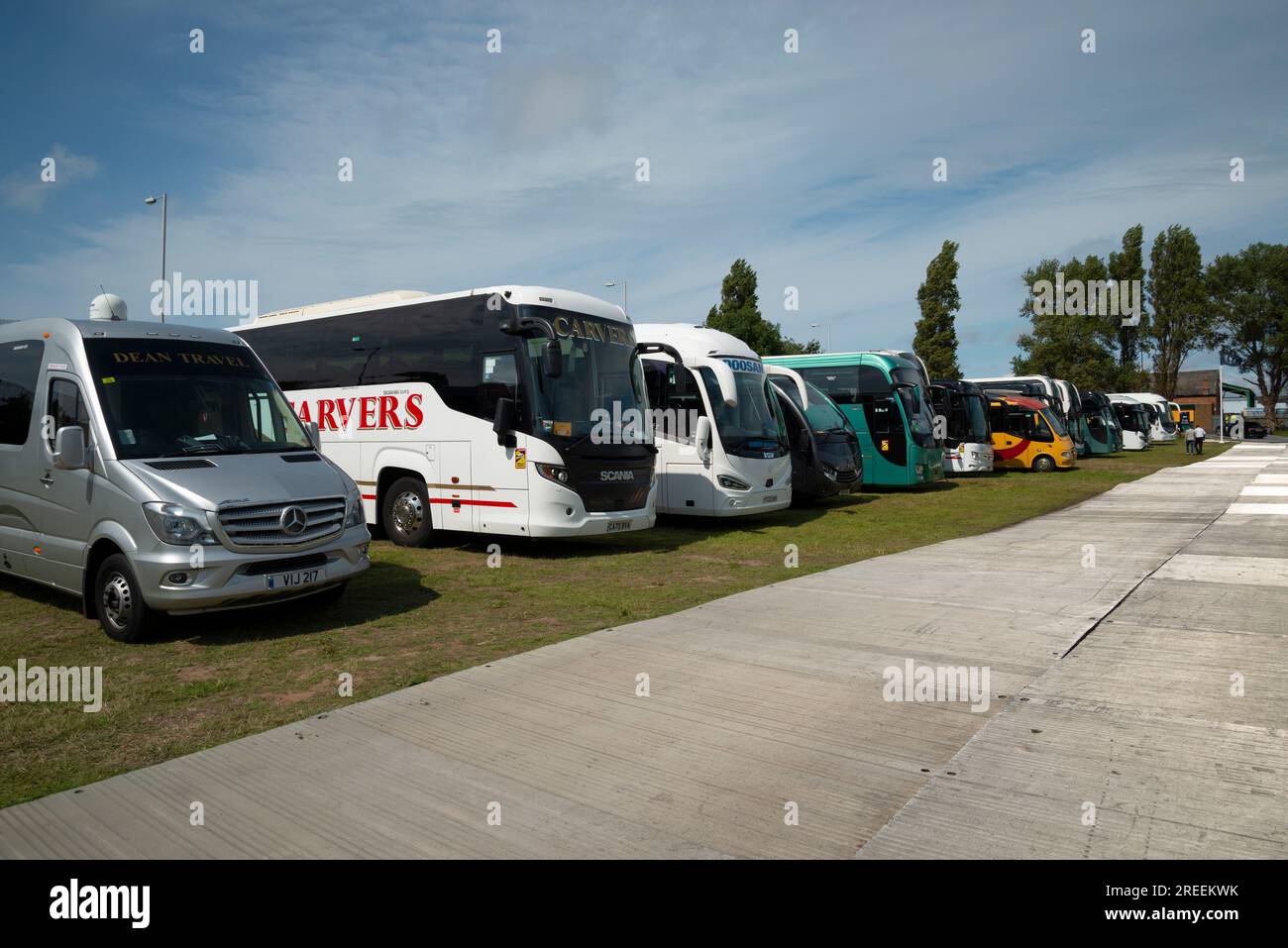 Parked lines of buses and coaches used to transport spectators and ...