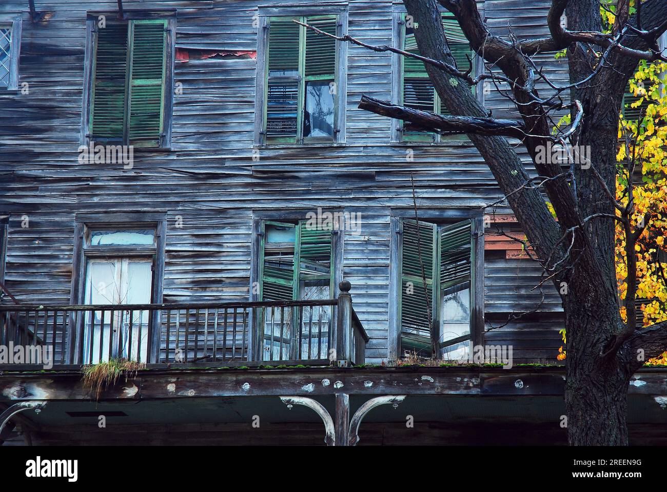 An abandoned wooden home starts to decay and fall apart, giving the ...