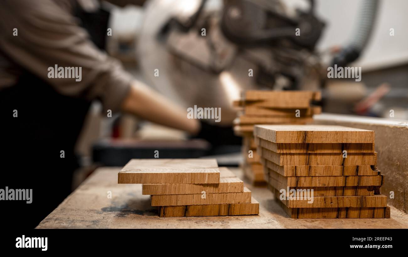Side view female carpenter studio using electric saw. Resolution and ...