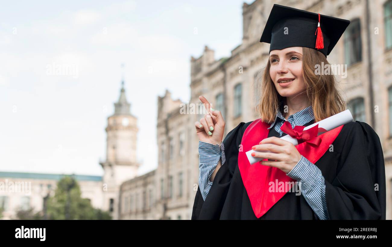 Graduation concept with portrait happy girl Stock Photo - Alamy