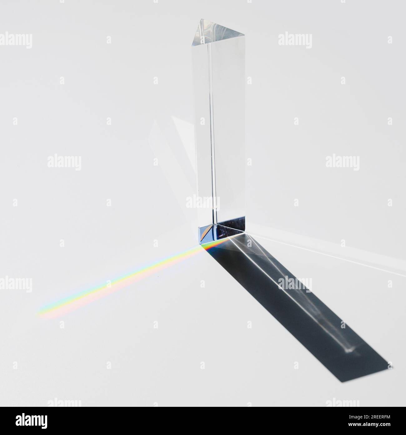 Prism dispersing sunlight splitting into spectrum white background ...