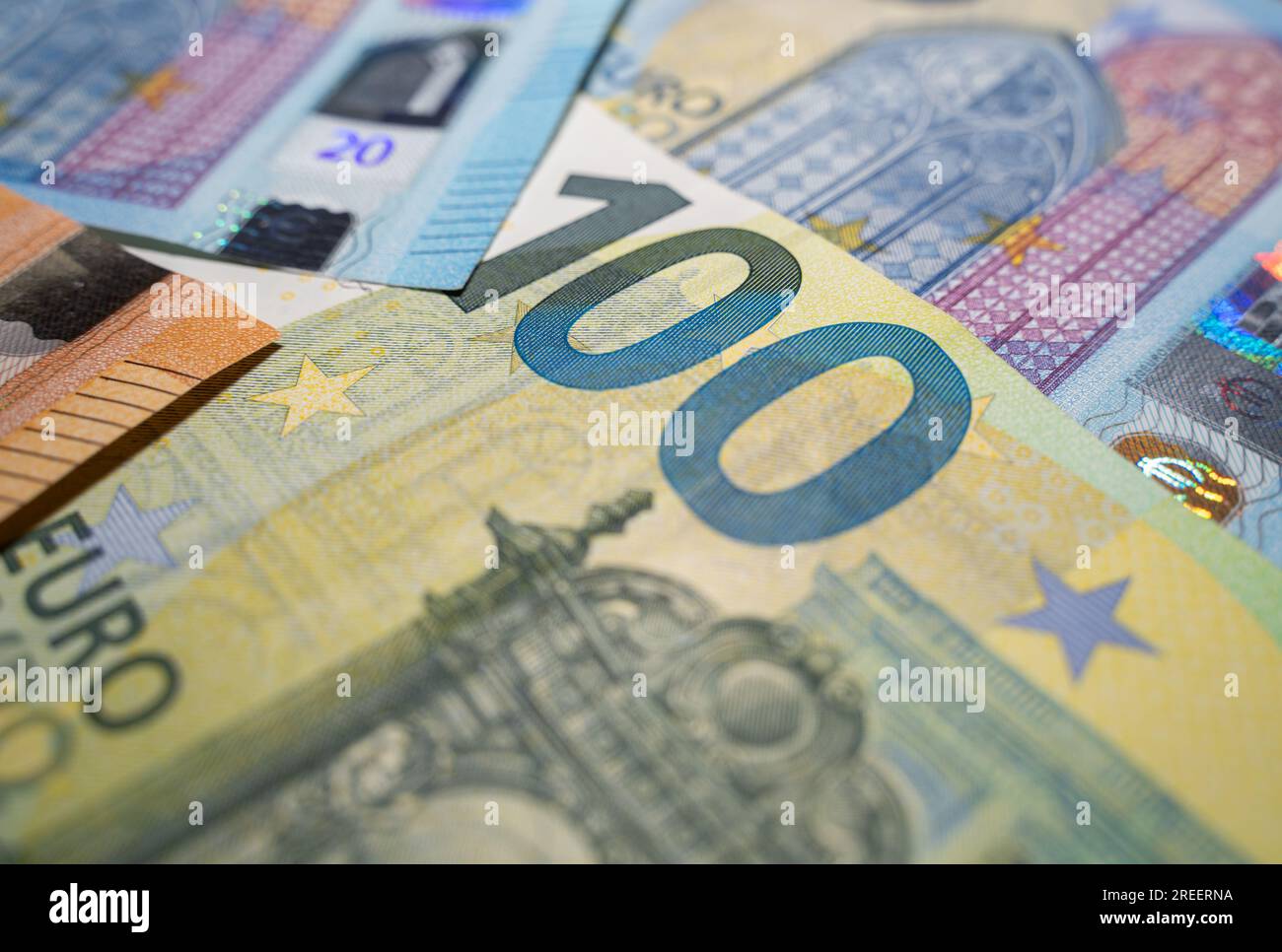 100 euro banknote and several 20 euro banknotes in the background Stock ...