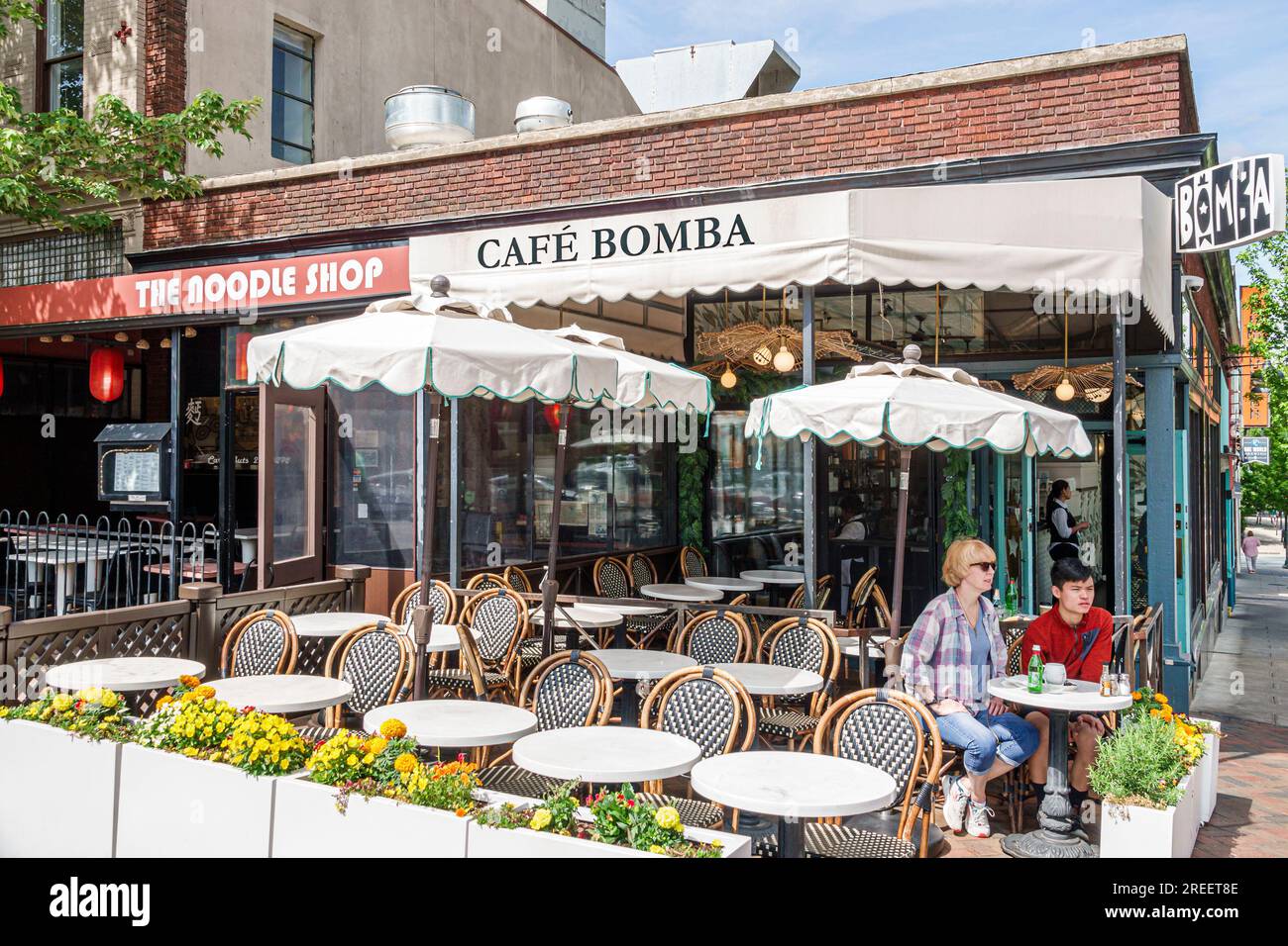 Cafe bomba restaurant alfresco dining tables umbrellas hi-res stock ...