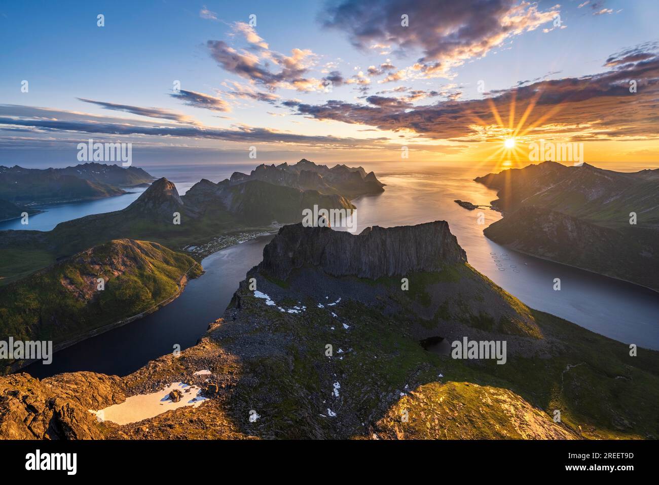 View over Senja's fjords and mountain peaks under the midnight sun ...
