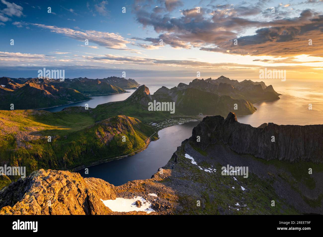 View over Senja's fjords and mountain peaks under the midnight sun ...