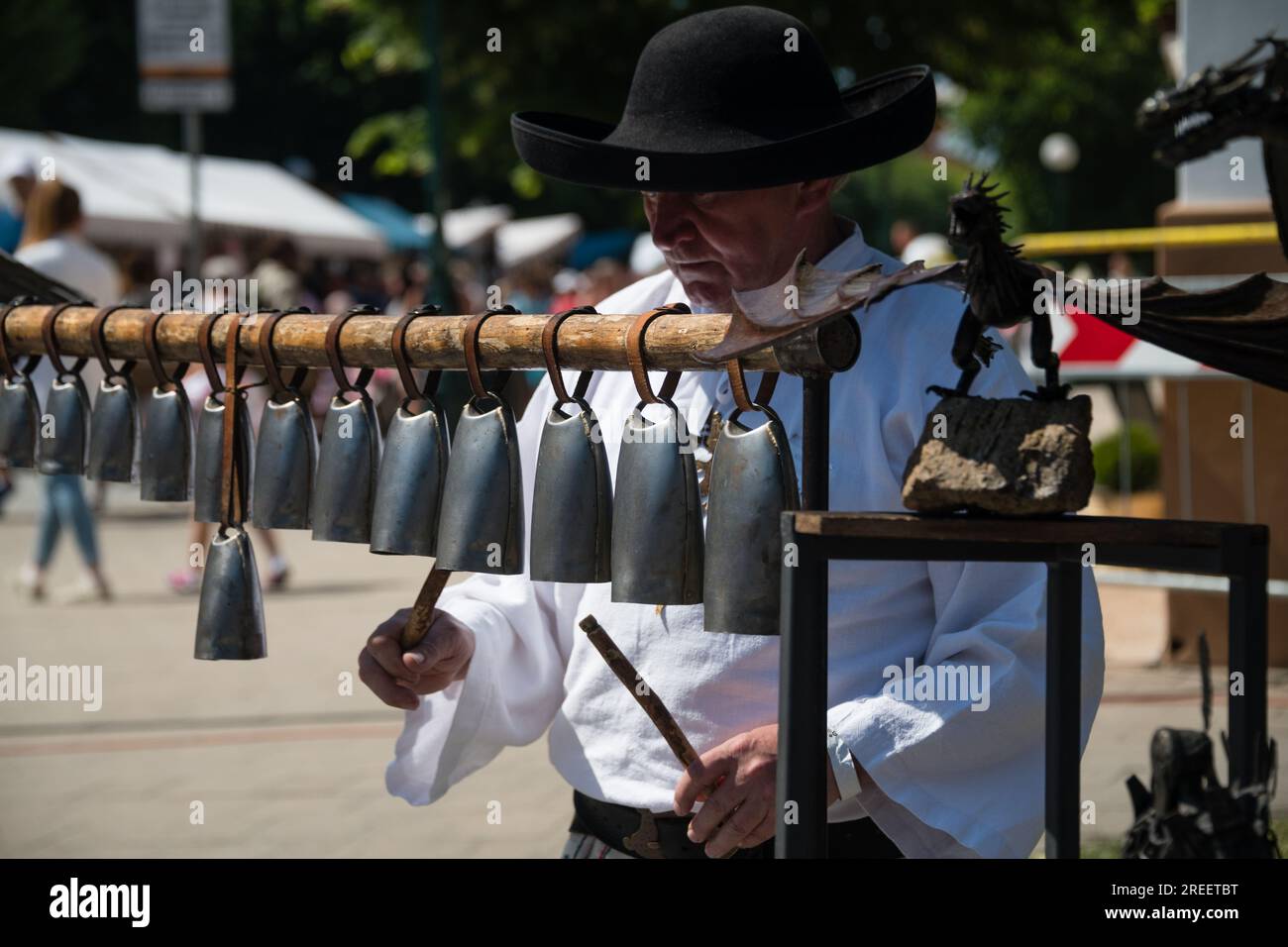 KEZMAROK, SLOVAKIA - JUL 9, 2023: Handicraftsman plays on handmade ...