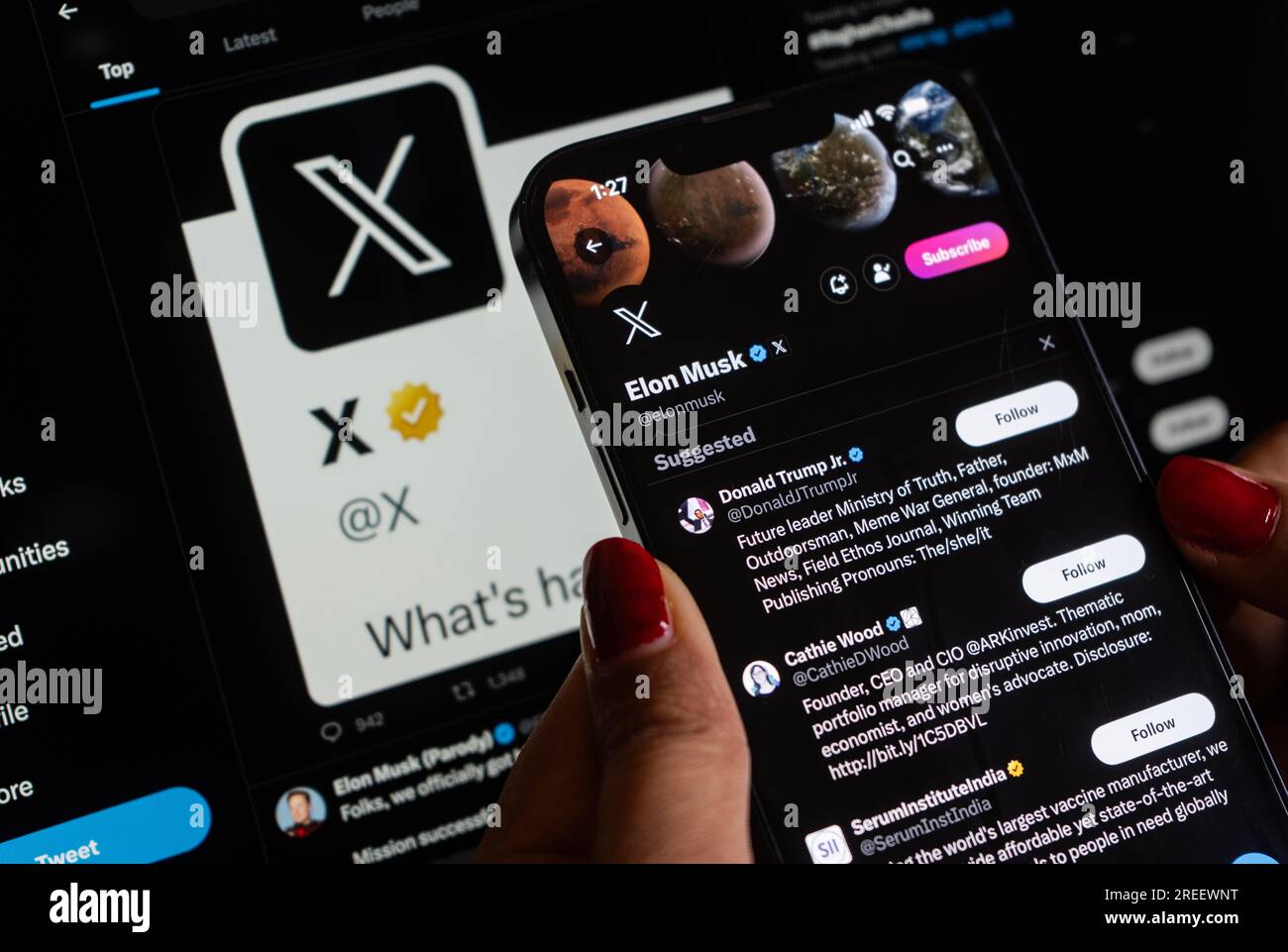 In this photo illustration a person browsing Elon musk X account ...