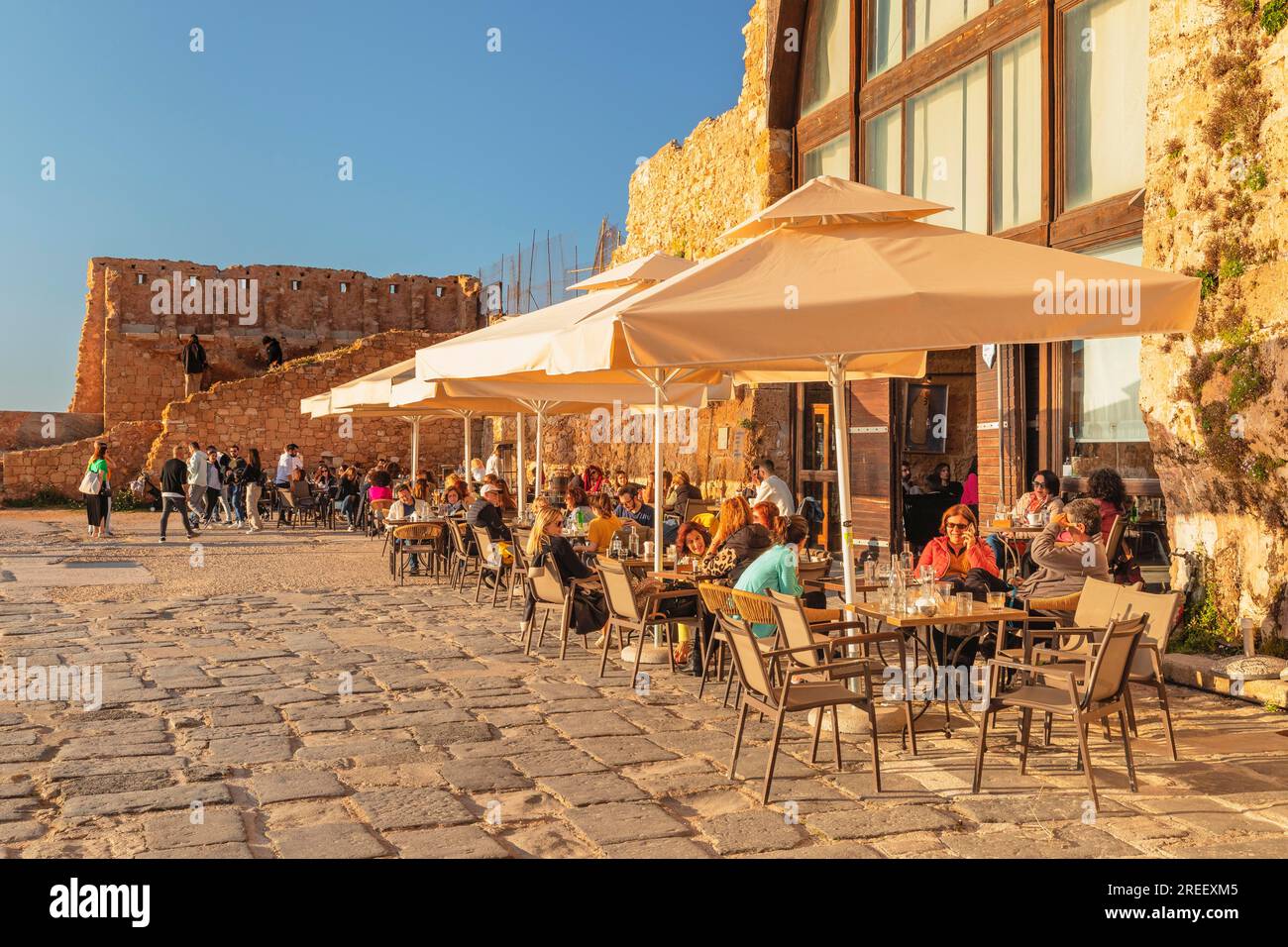 Street cafe at the Venetian harbor in the old town of Chania, Crete ...