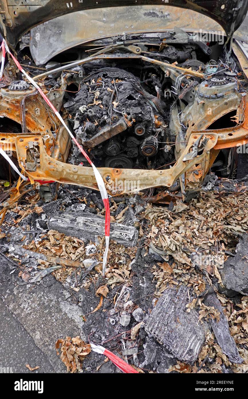 Destroyed and burnt engine, arson attack on a car, Berlin, Germany ...