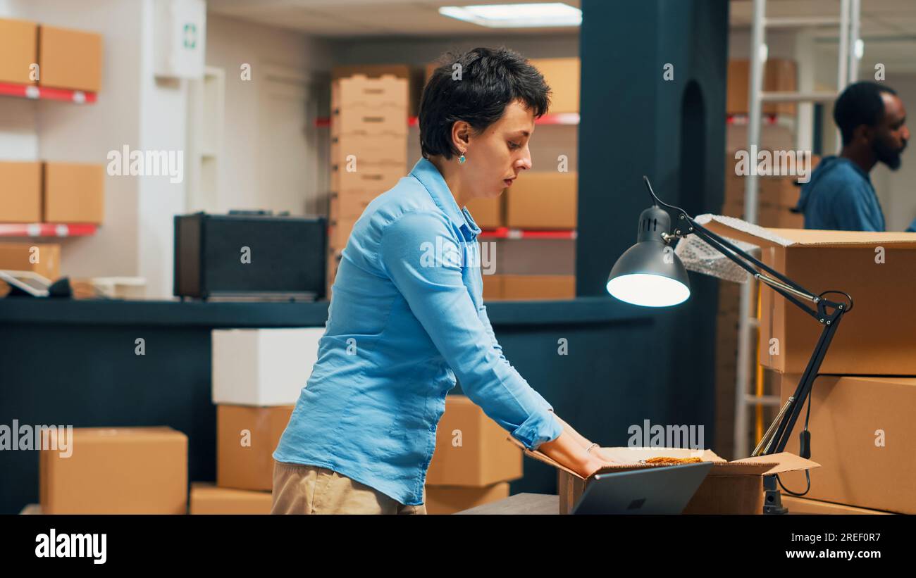 Young entrepreneur female sorting boxes hi-res stock photography and ...