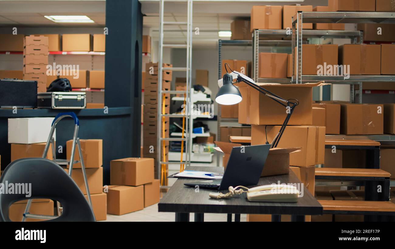 Storage room filled with merchandise packed in boxes, placed on shelves ...