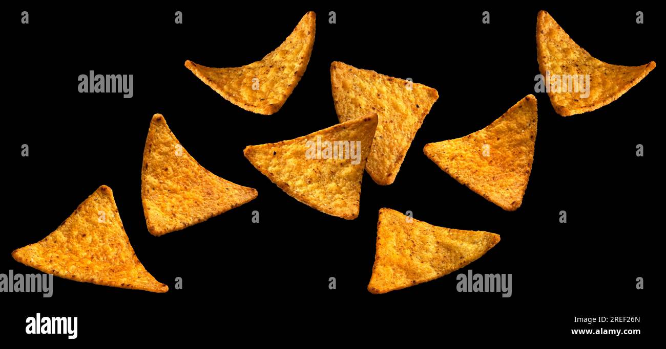 Falling corn chips, hot Mexican nachos isolated on black background ...
