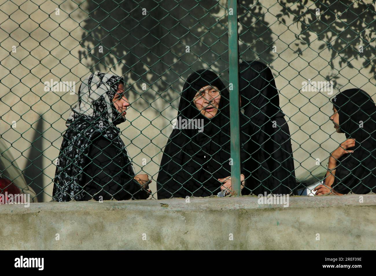 Kashmiri Shiite Muslim women watch a religious procession on the ...