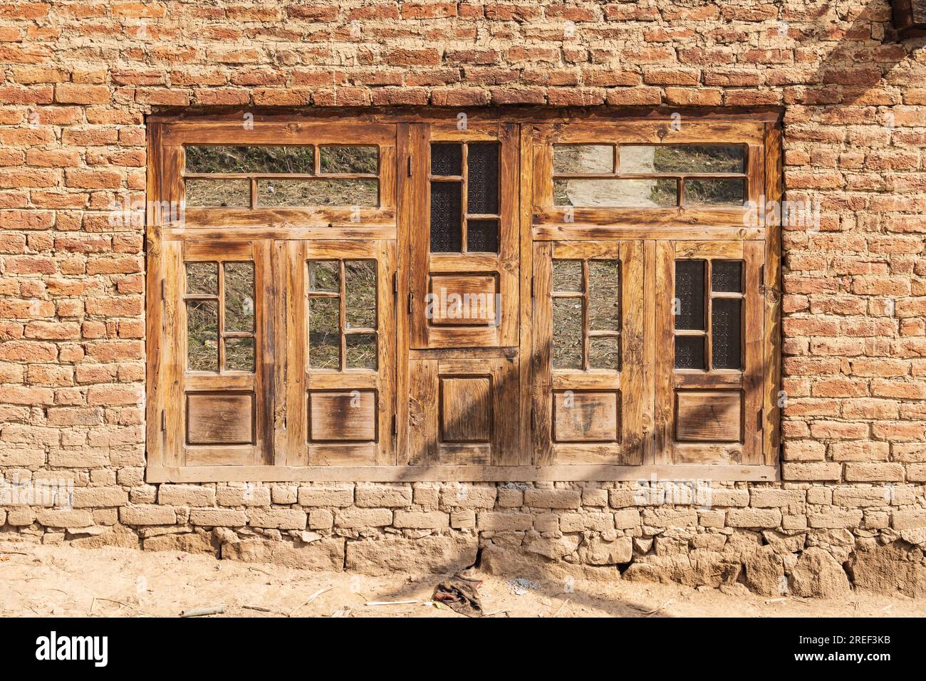 Wangat, Kangan, Jammu and Kashmir, India. Wooden window in a brick ...