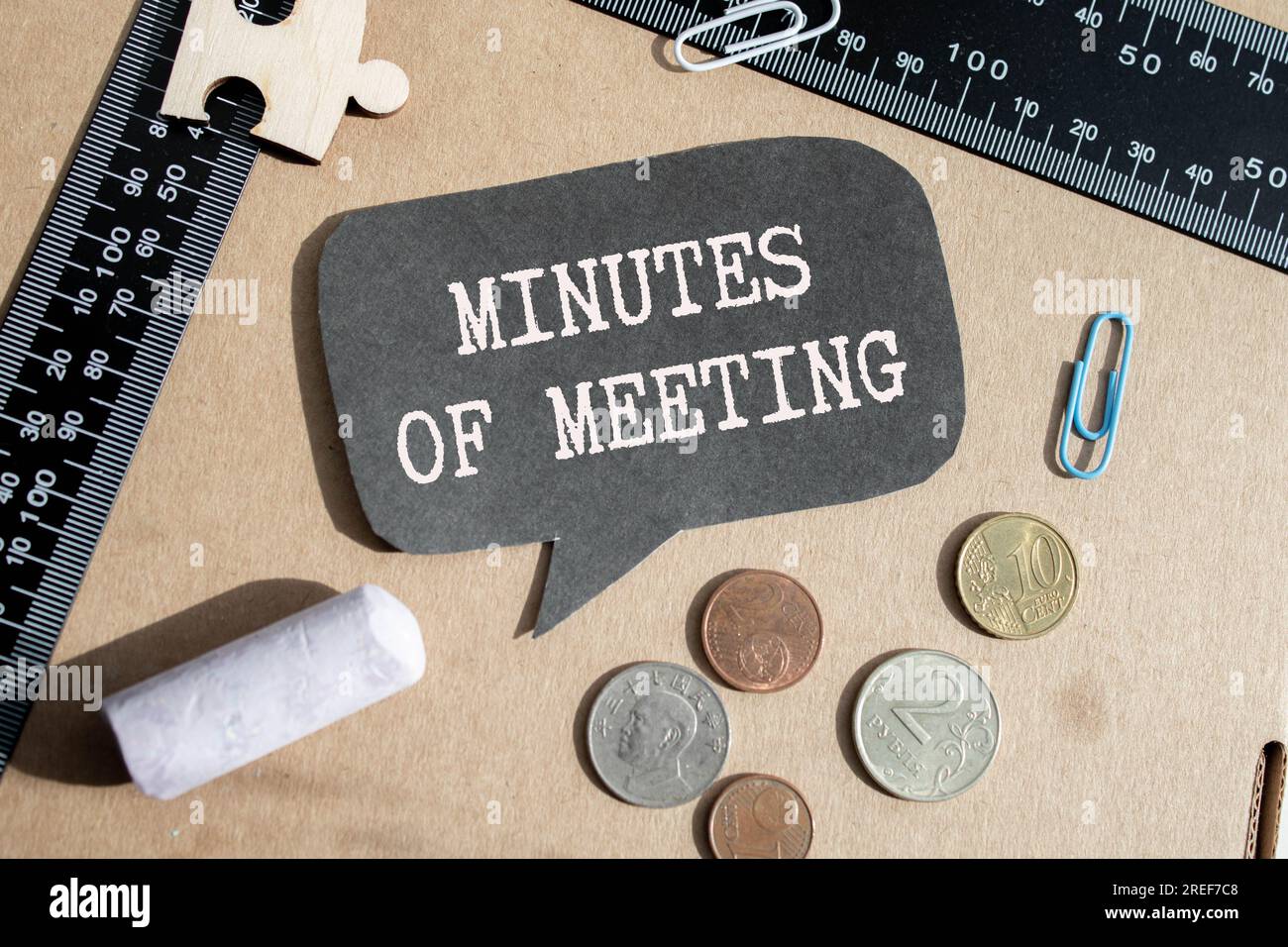 MINUTES OF THE MEETING text on a paper on the colorful paper background ...