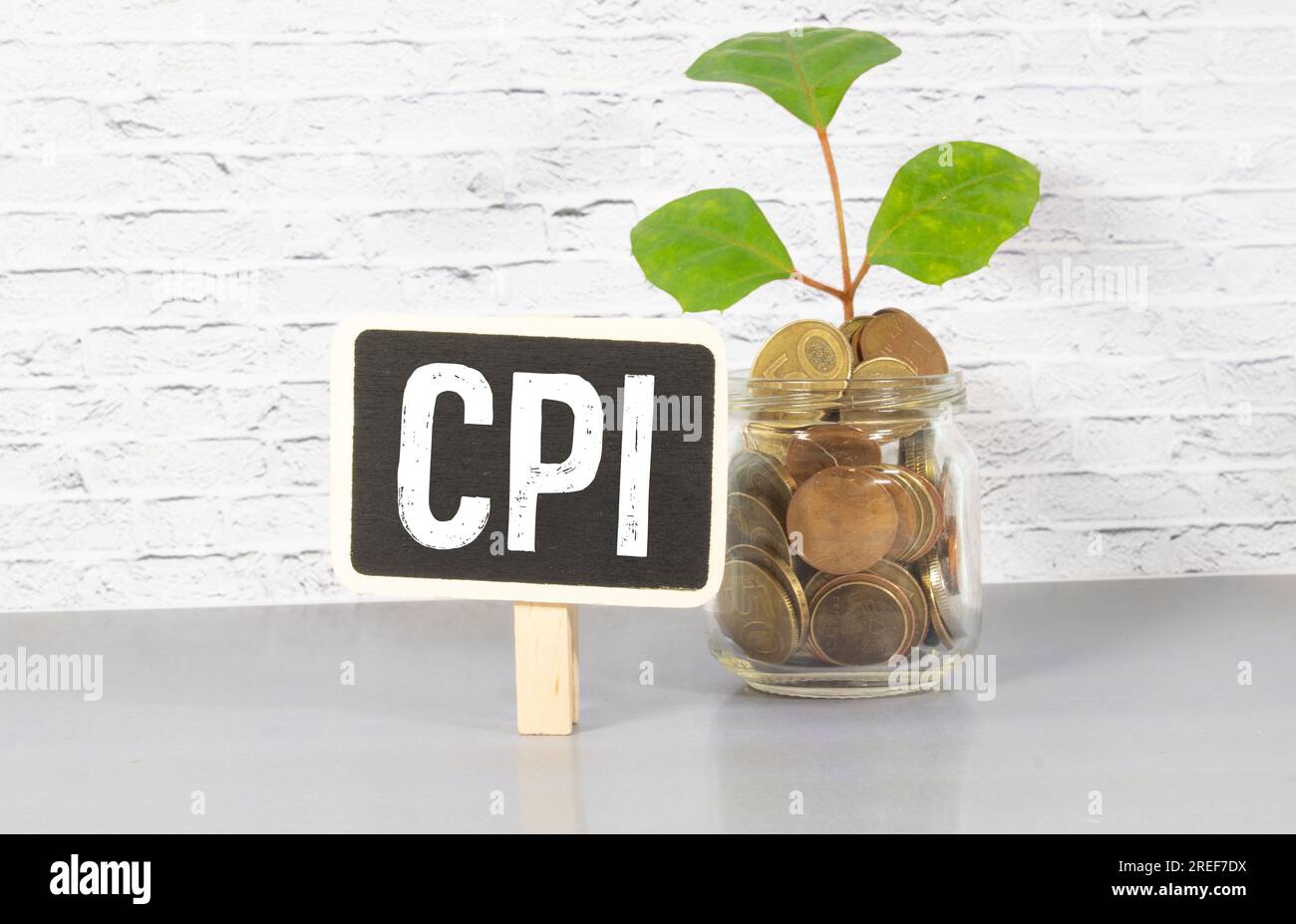 CPI text on a wooden block on graph background with pen and magnifier ...