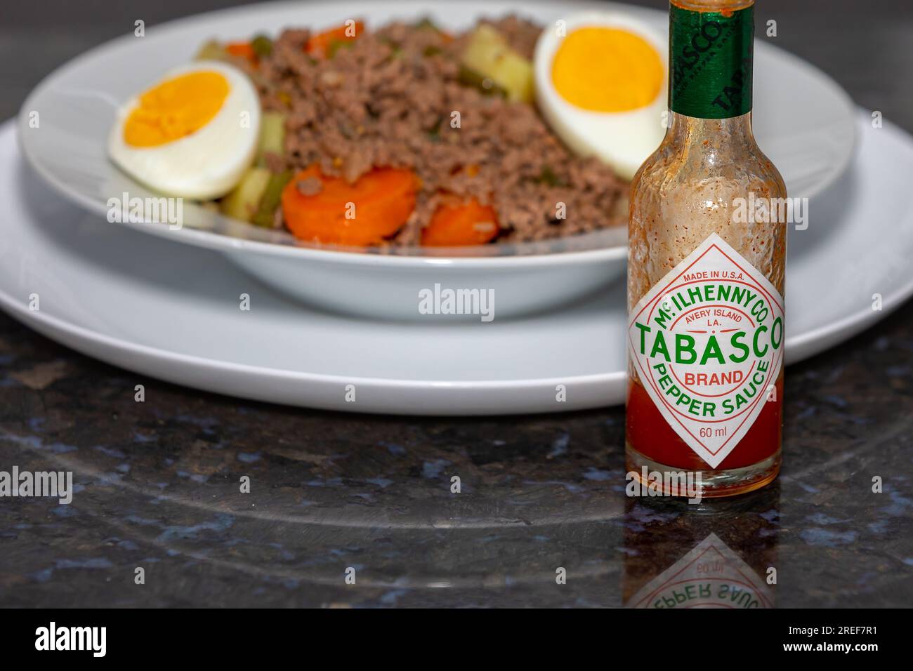 Traditional Tabasco pepper garnishing ground beef dish with vegetables ...