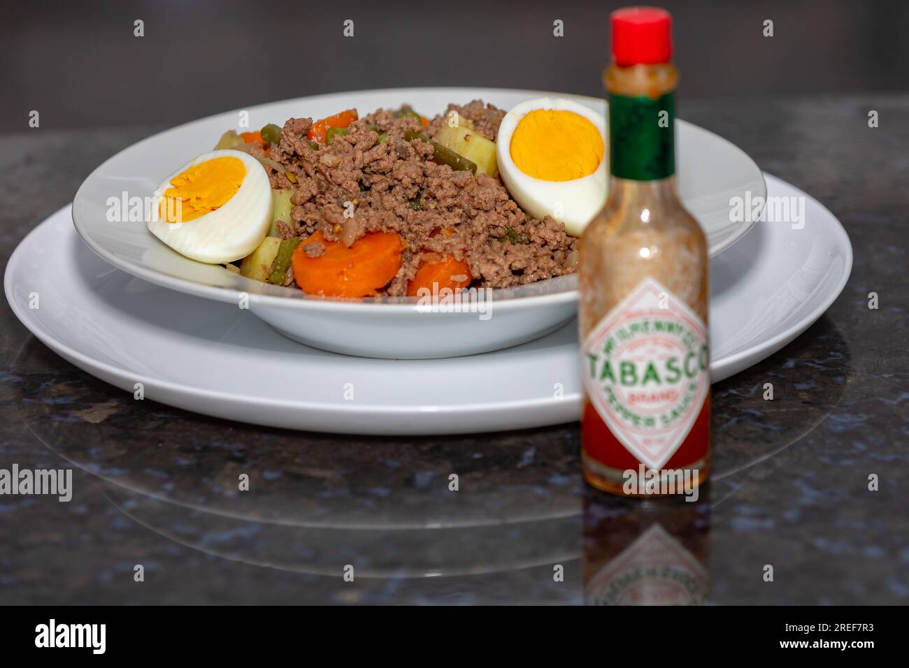 Traditional Tabasco pepper garnishing ground beef dish with vegetables ...