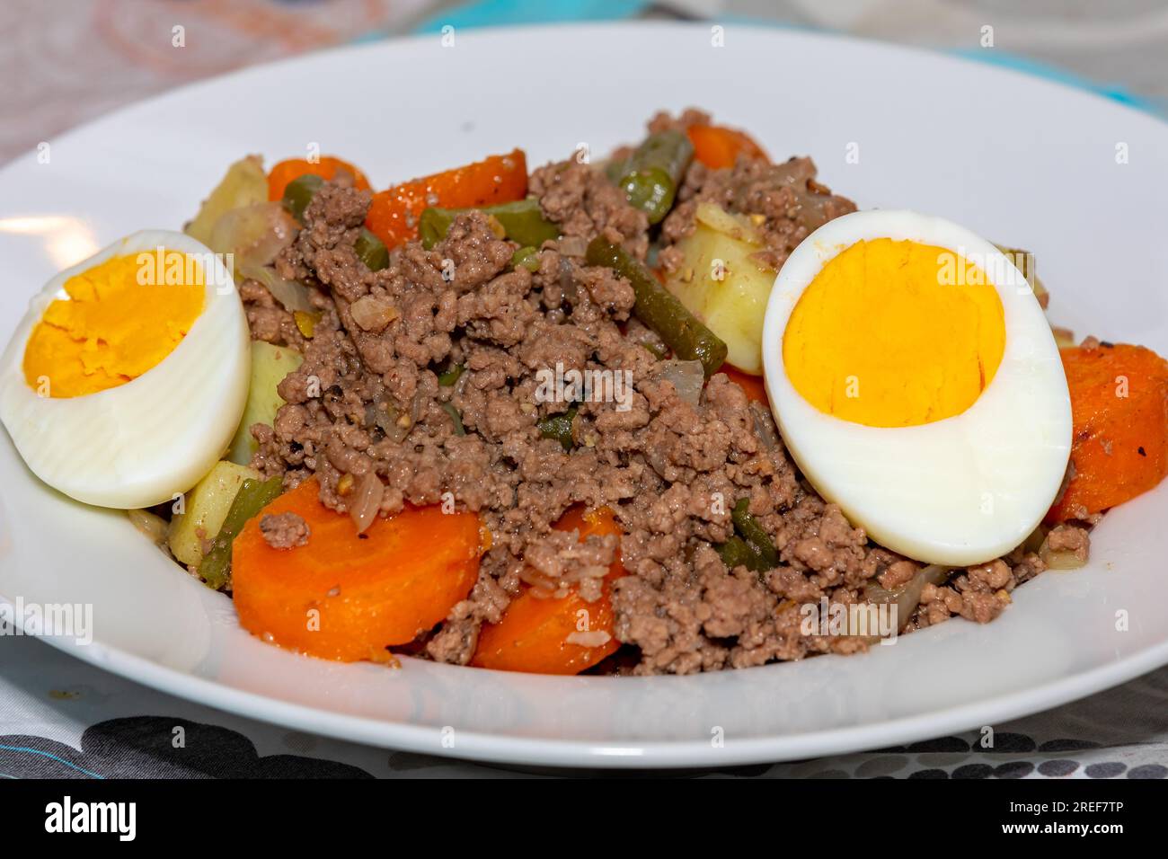 Traditional Tabasco pepper garnishing ground beef dish with vegetables ...