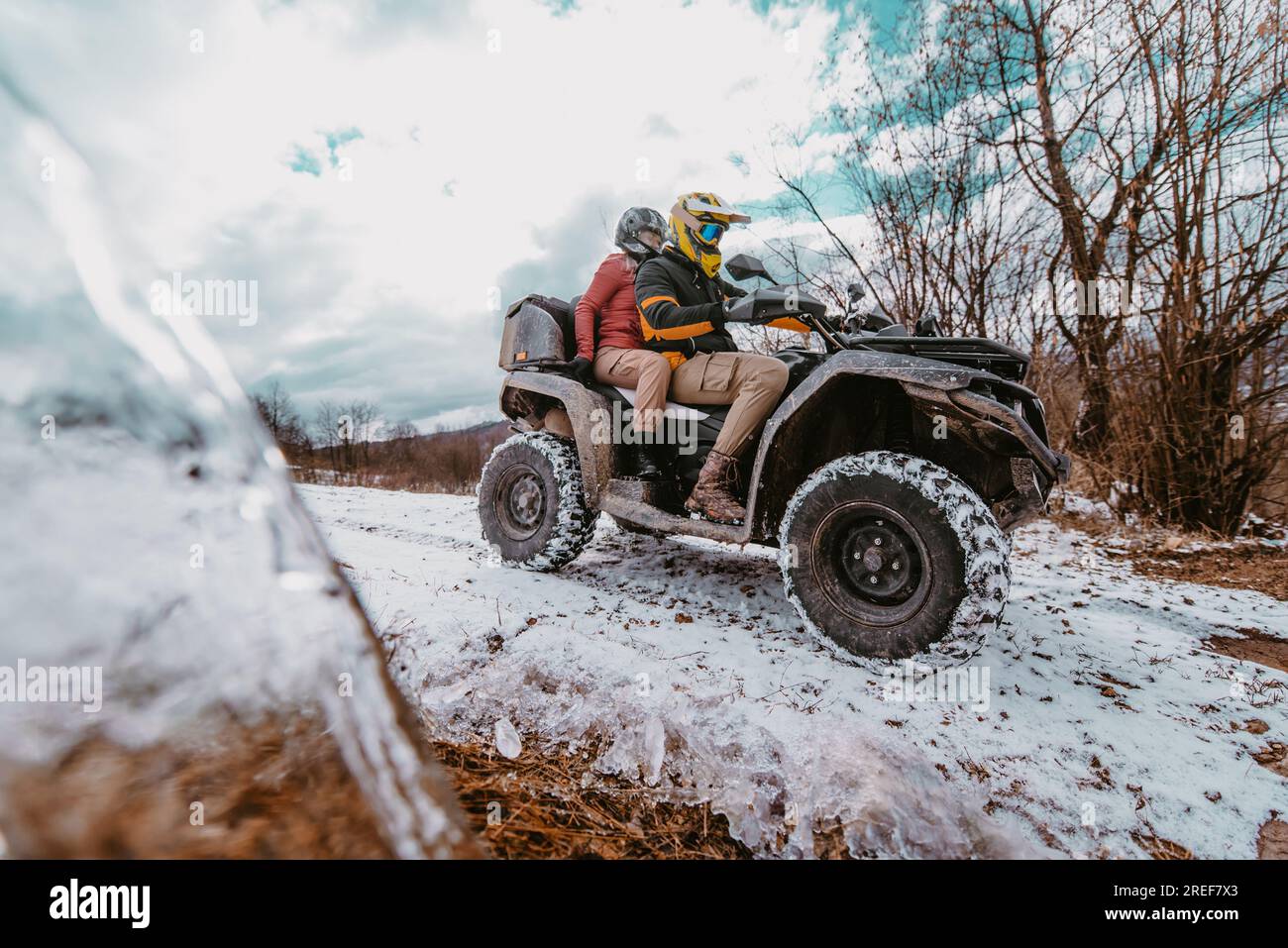 A young adventurous couple embraces the joy of love and thrill as they ...