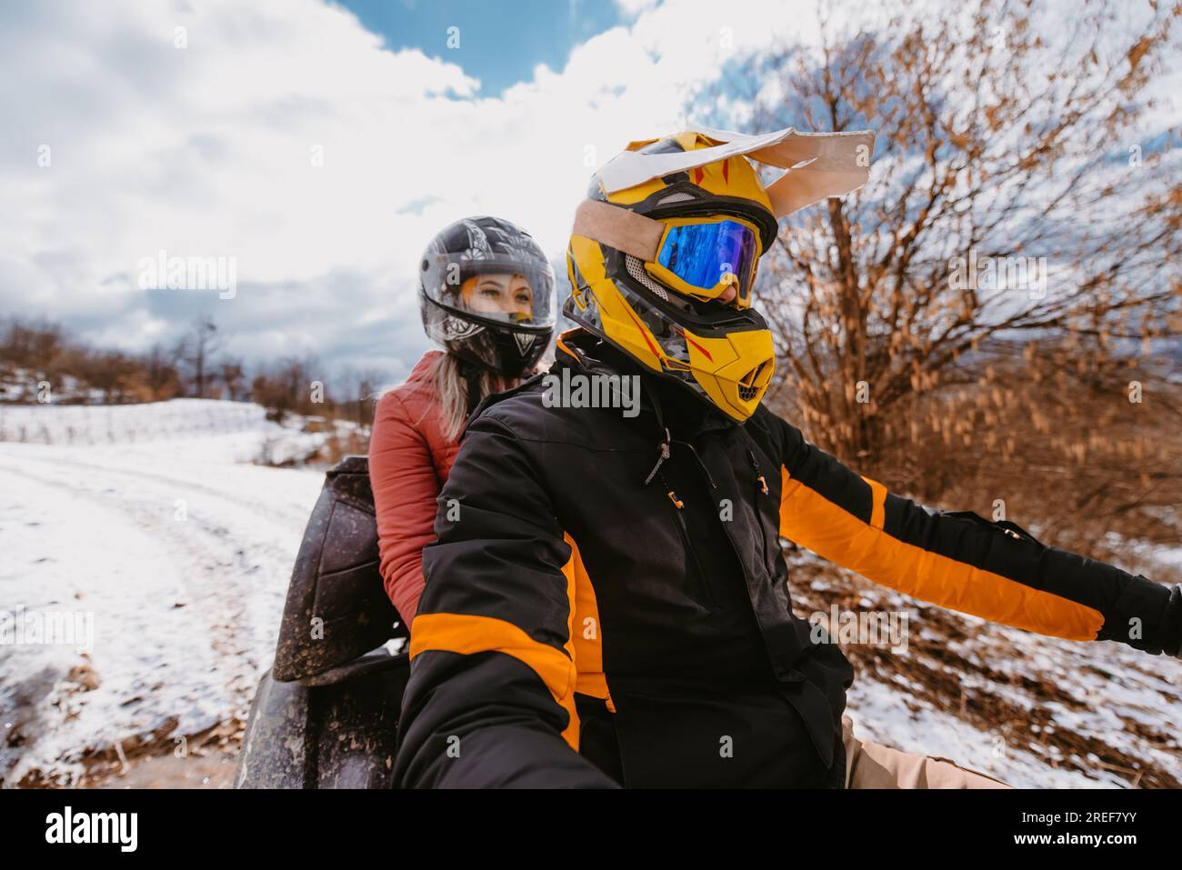 A young adventurous couple embraces the joy of love and thrill as they ...