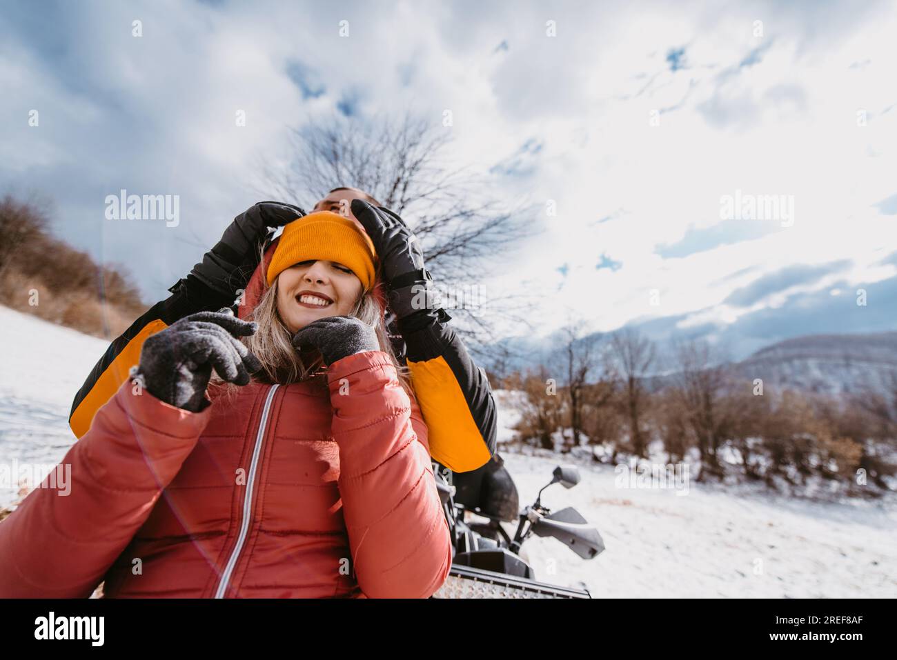 A young adventurous couple embraces the joy of love and thrill as they ...