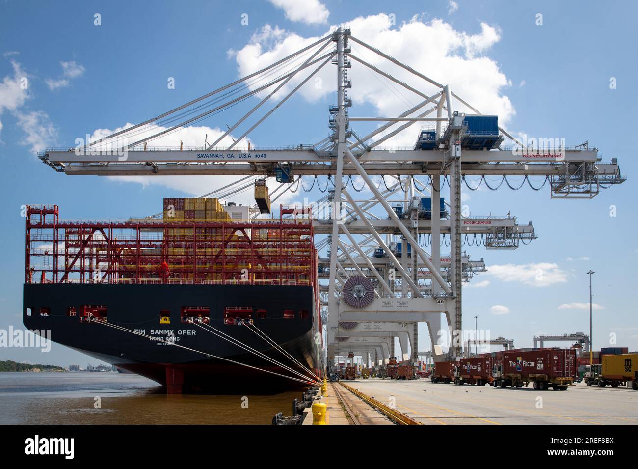 Containers are lifted off a container ship by quay cranes, at the Port ...